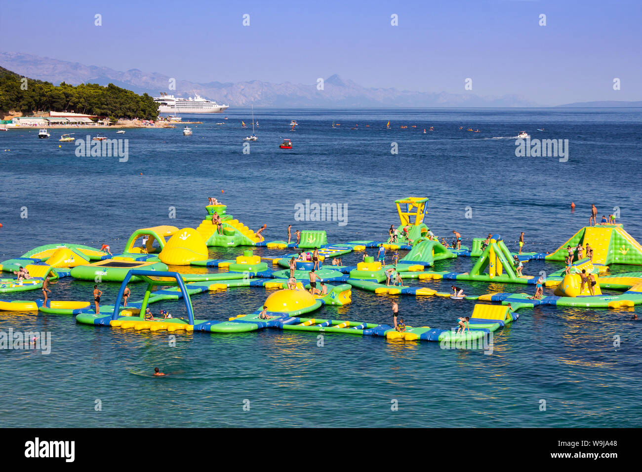 BOL, CROATIA - AUGUST 06, 2019: Water fun park on a Zlatni Rat beach in ...