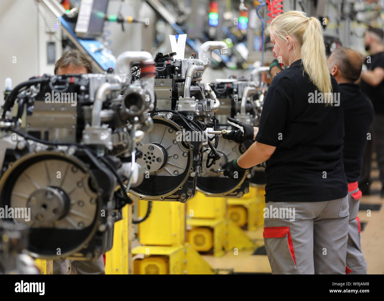 Cologne, Germany. 14th Aug, 2019. Employees of the engine manufacturer ...