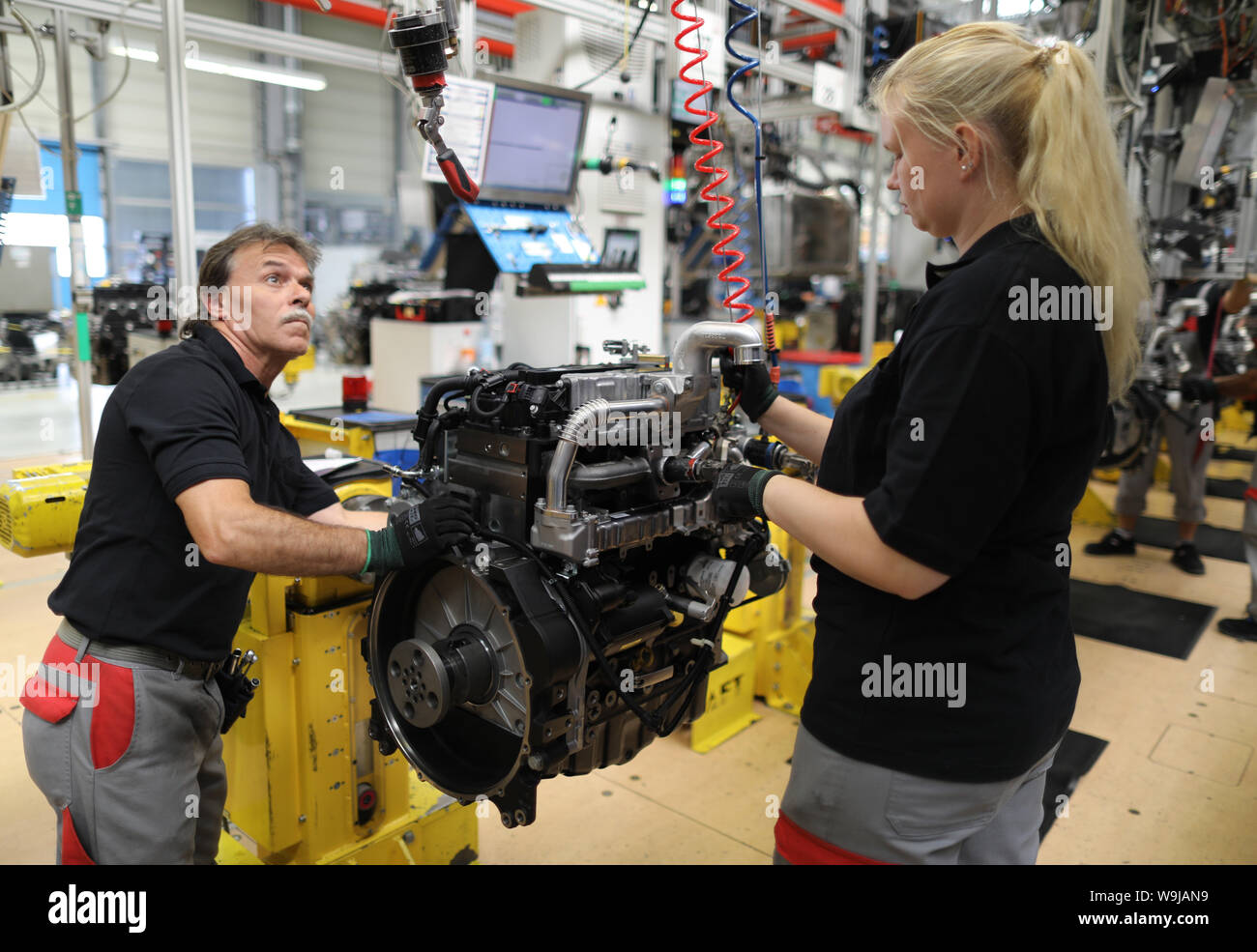 Cologne, Germany. 14th Aug, 2019. Employees of the engine manufacturer ...