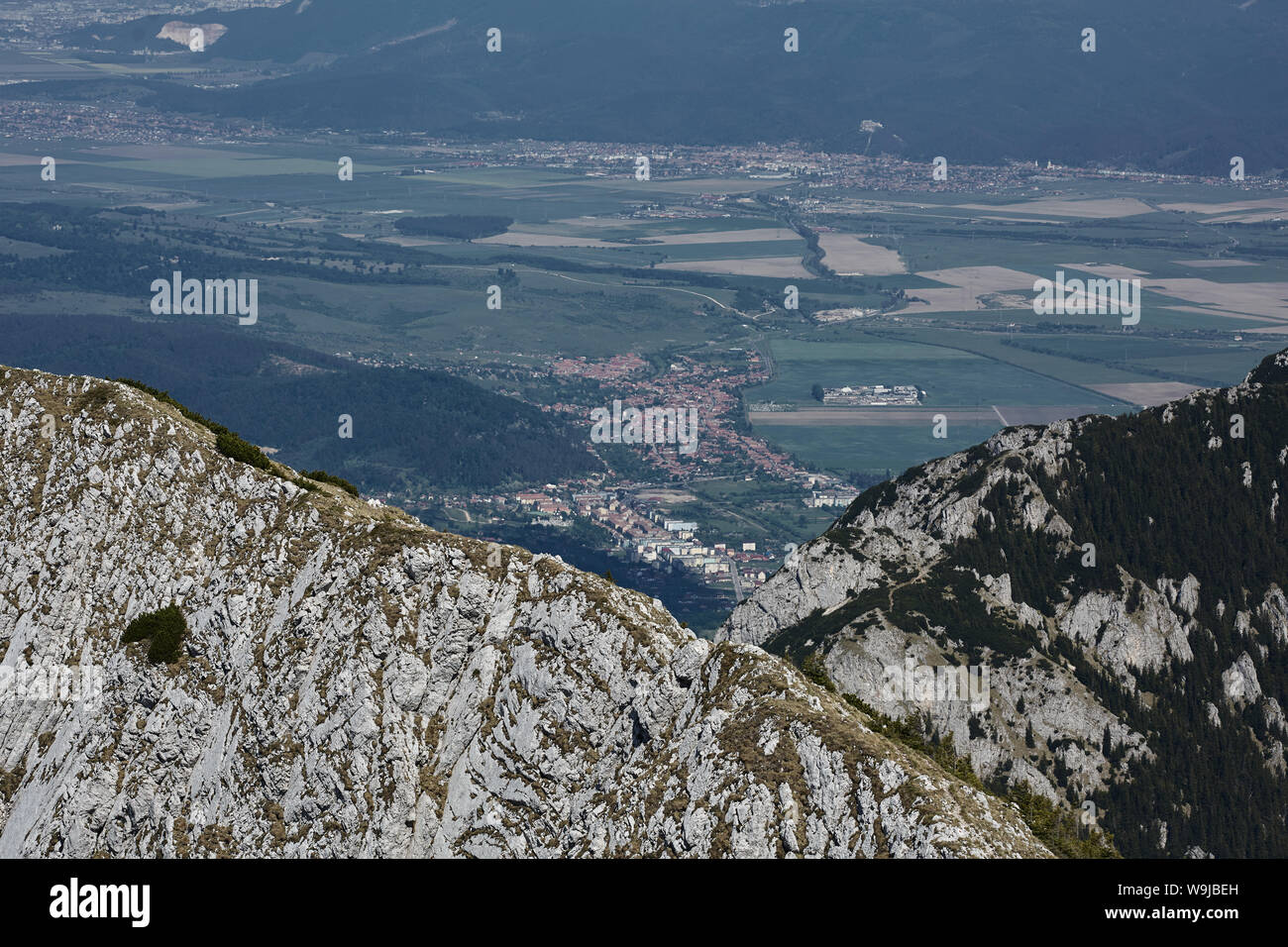 Mountain landscape with an afforested valley Stock Photo - Alamy