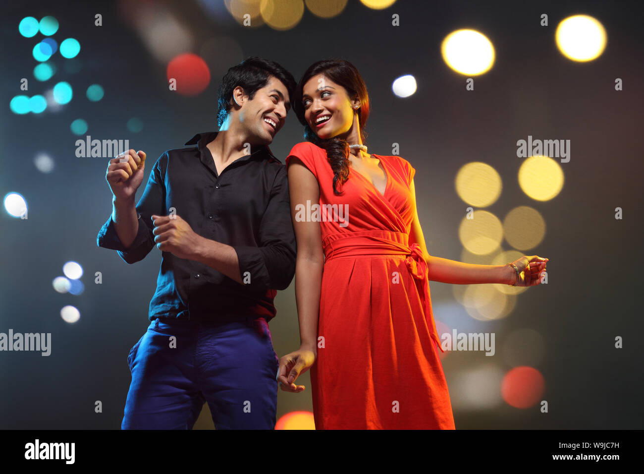 Young couple dancing at a nightclub Stock Photo - Alamy