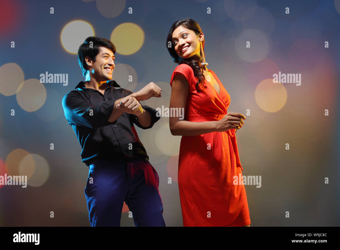 Young couple dancing at a nightclub Stock Photo - Alamy