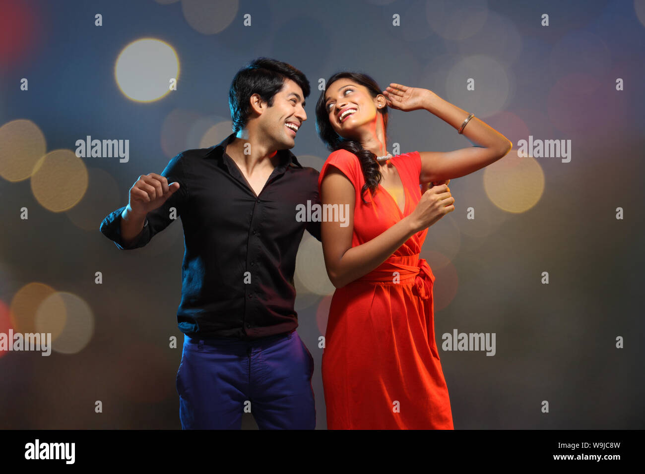 Young couple dancing at a nightclub Stock Photo - Alamy