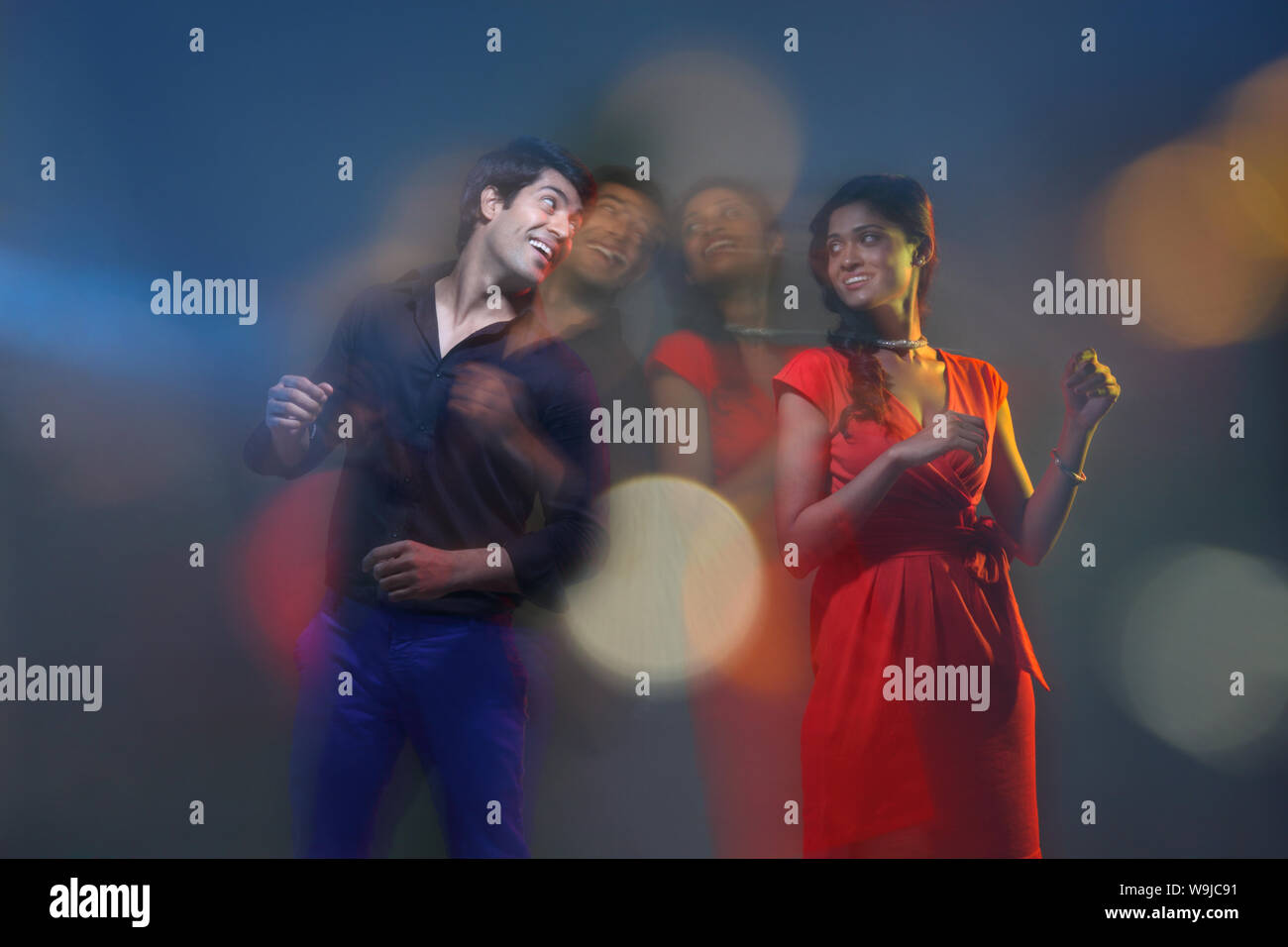 Young couple dancing at a nightclub Stock Photo - Alamy