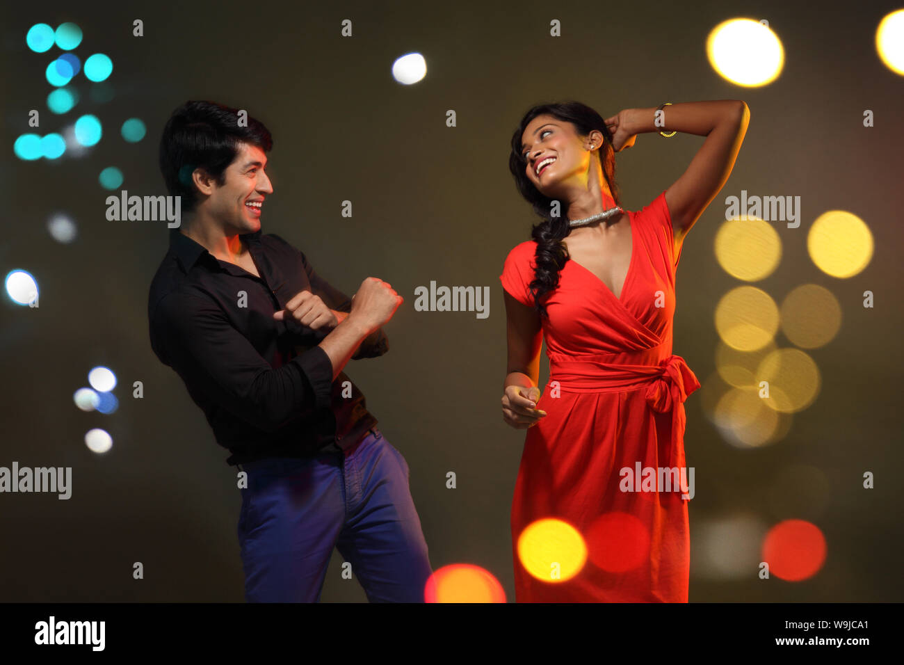 Young couple dancing at a nightclub Stock Photo - Alamy
