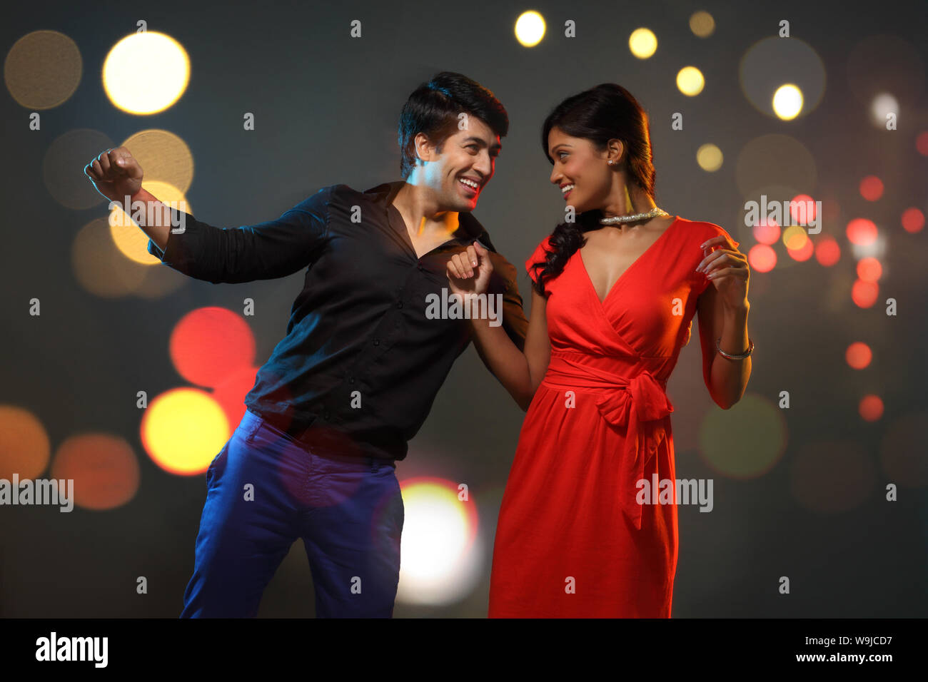 Young couple dancing in a disco hi-res stock photography and images - Alamy