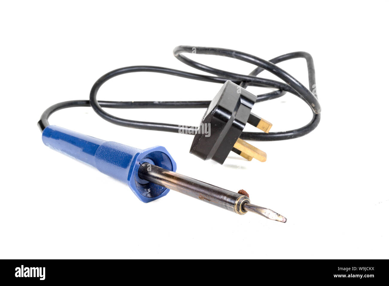 An electrical soldering iron with British plug isolated on a white ...