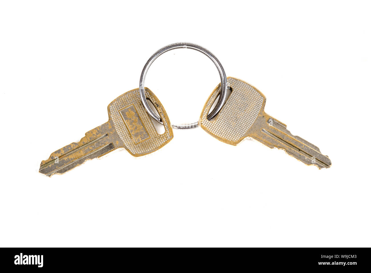 A pair of keys on a white background Stock Photo - Alamy