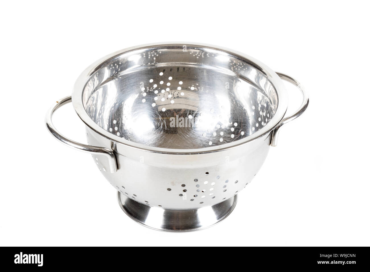 A metal colander isolated on a white background Stock Photo - Alamy