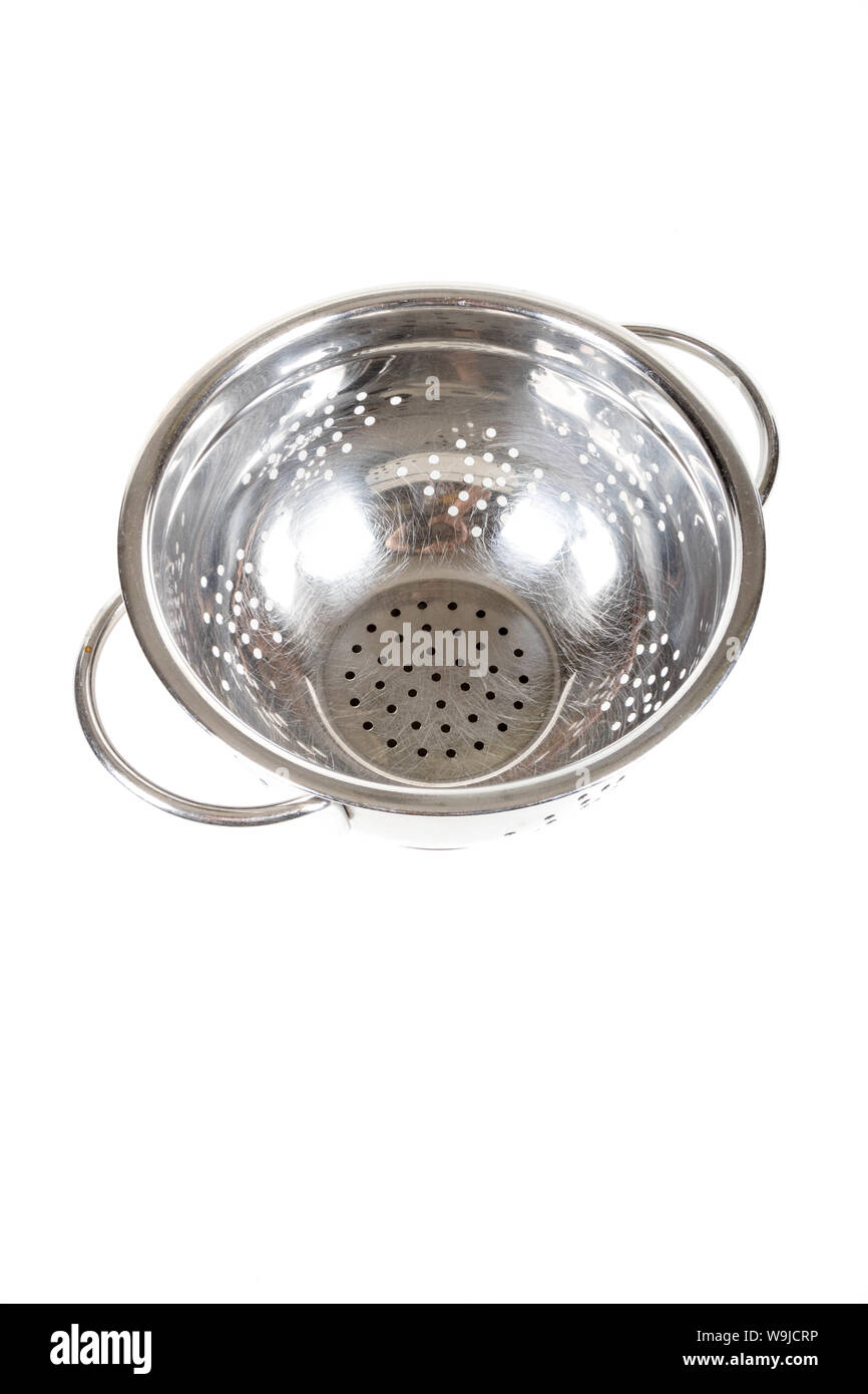 A metal colander isolated on a white background Stock Photo - Alamy