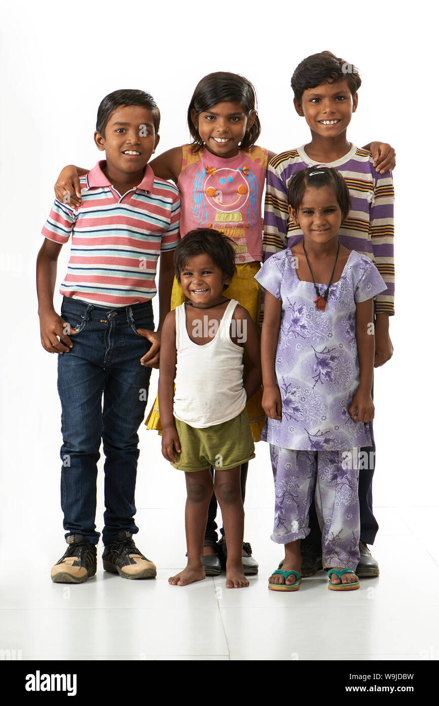 Group of friends standing together and smiling Stock Photo - Alamy