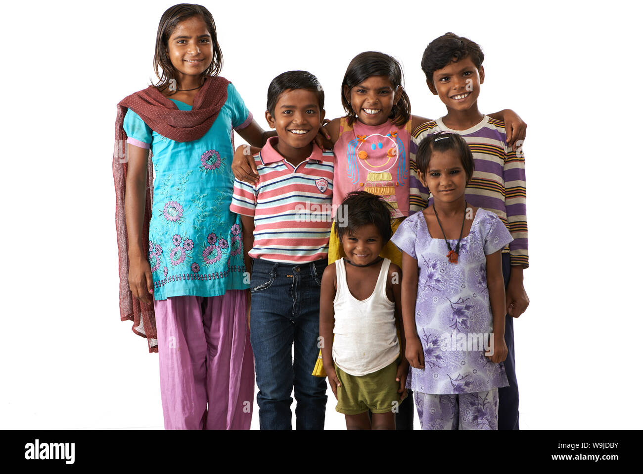 Group of friends standing together and smiling Stock Photo - Alamy