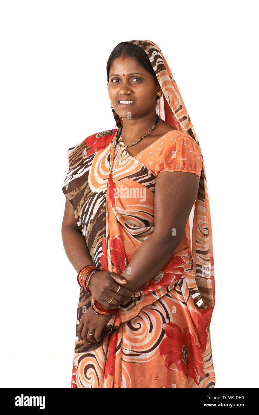 Rural woman standing and smiling Stock Photo - Alamy