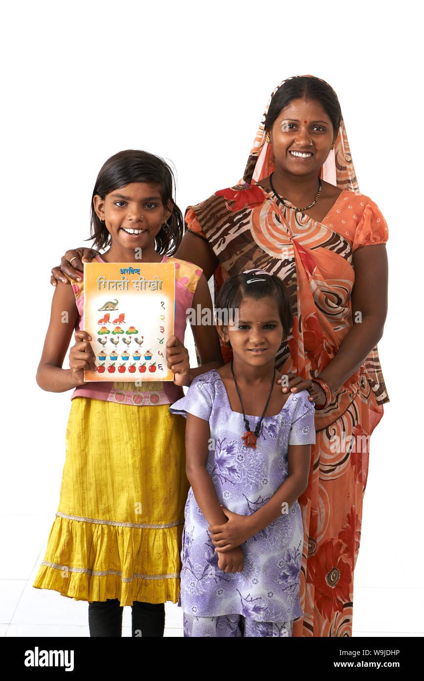 Family standing together and smiling Stock Photo - Alamy