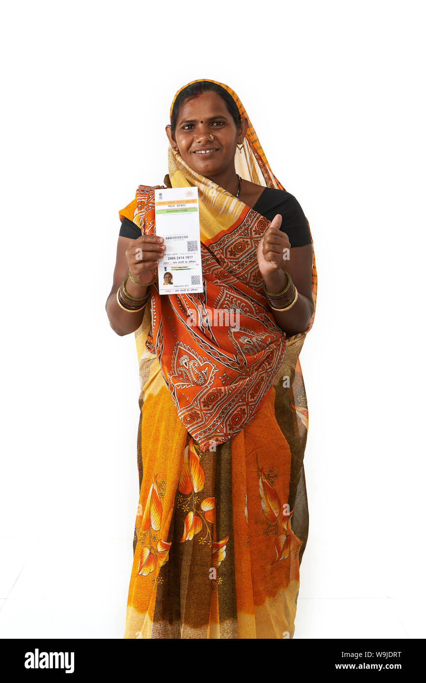 Rural woman showing an Aadhar card with thumbs up sign Stock Photo - Alamy