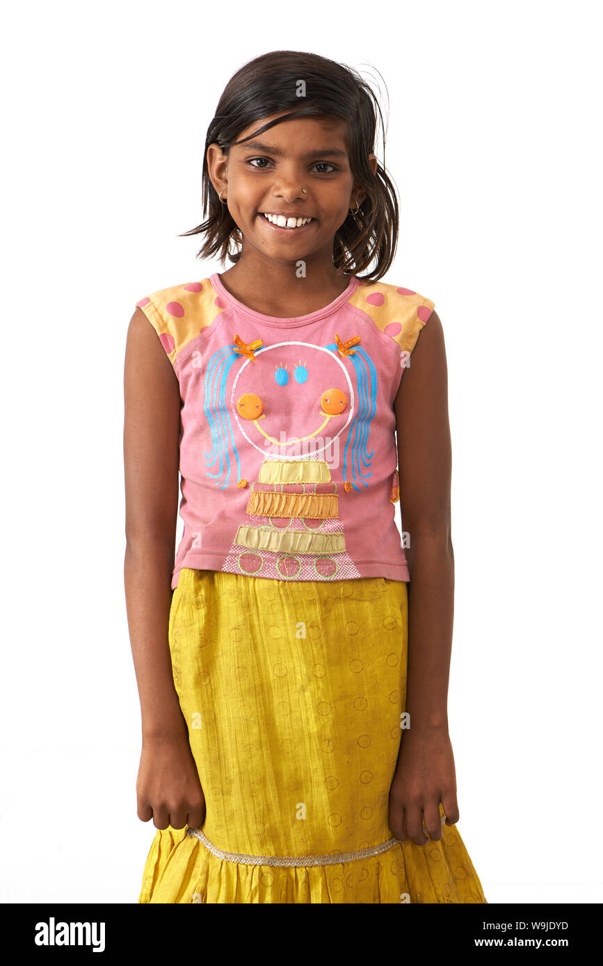 Girl standing and smiling Stock Photo - Alamy