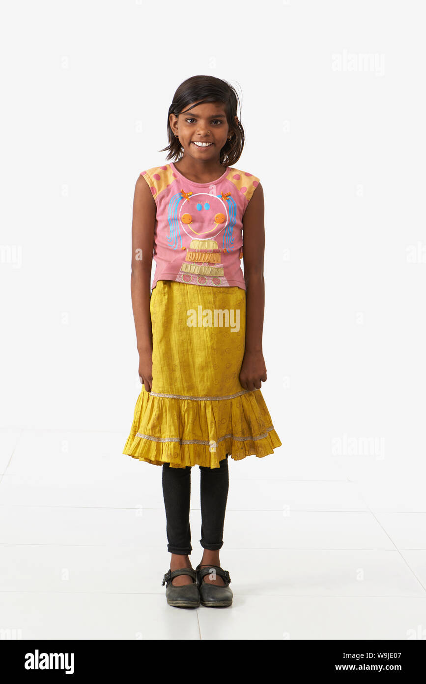 Girl standing and smiling Stock Photo - Alamy