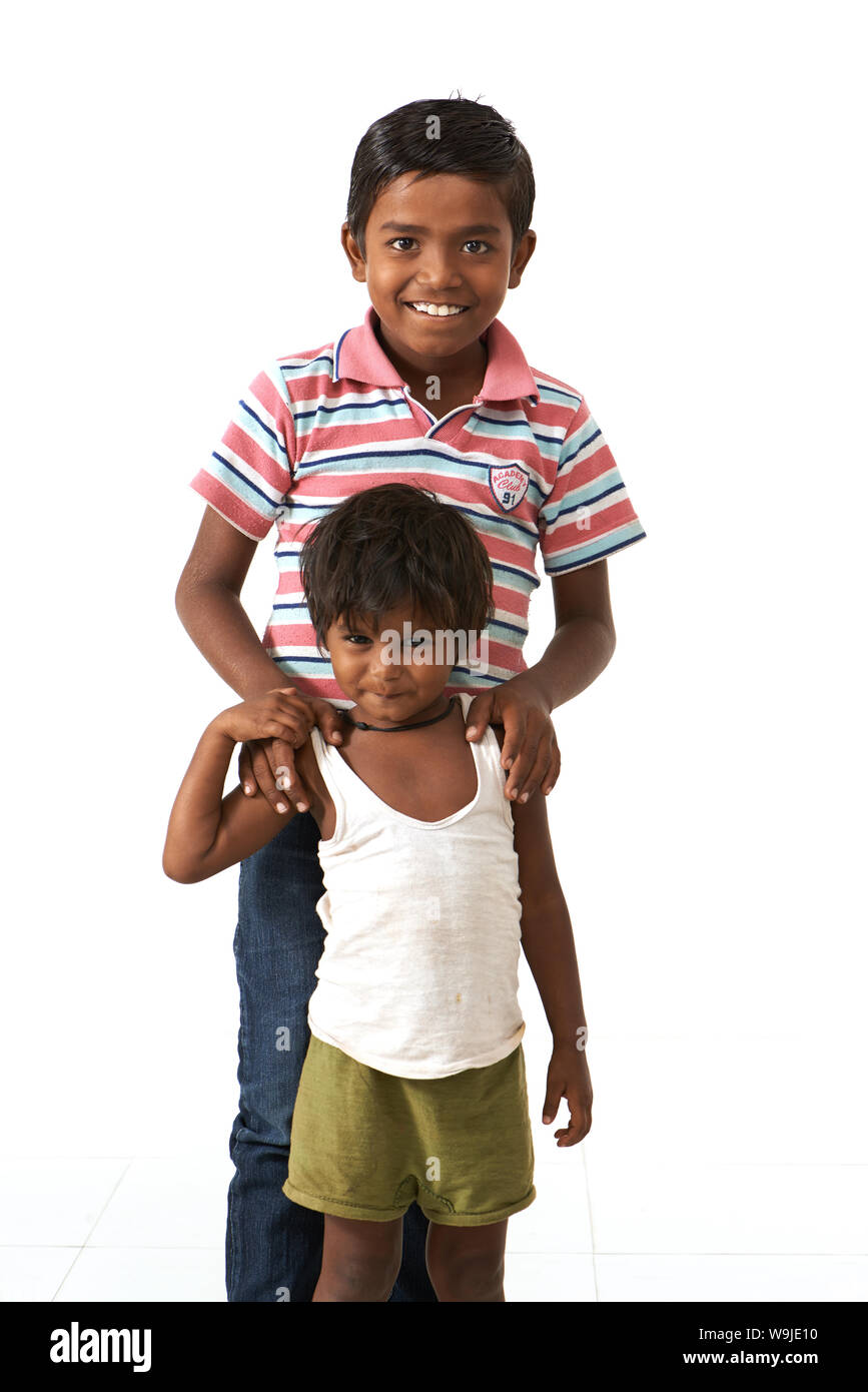 Two boys standing together Stock Photo - Alamy
