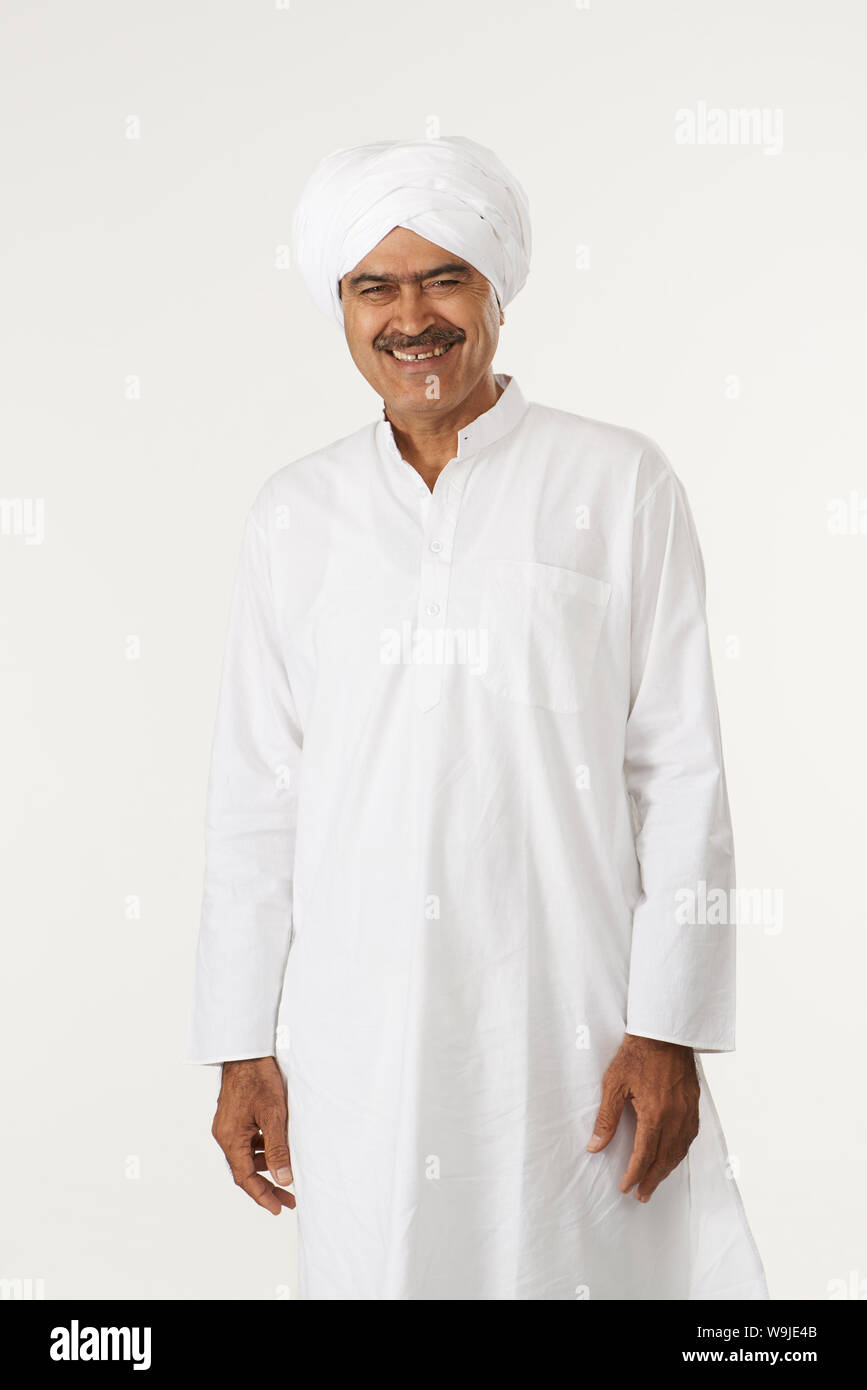 Rural man standing and smiling Stock Photo - Alamy