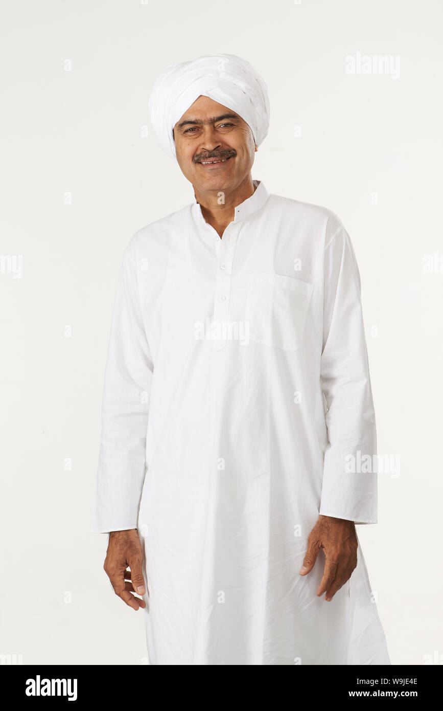 Rural man standing and smiling Stock Photo - Alamy