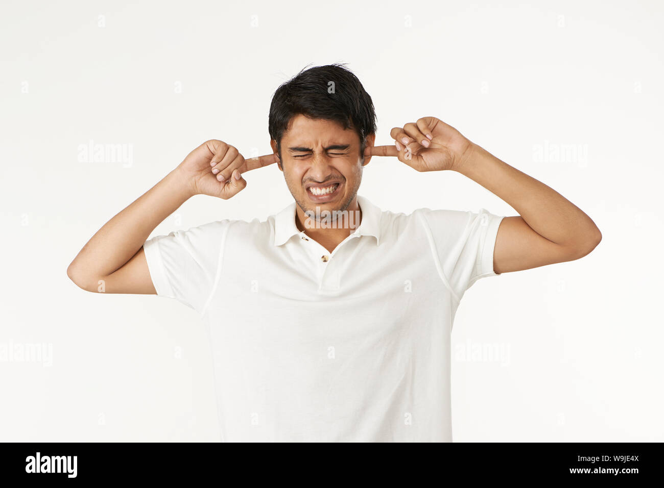 Fingers in ears man hi-res stock photography and images - Alamy