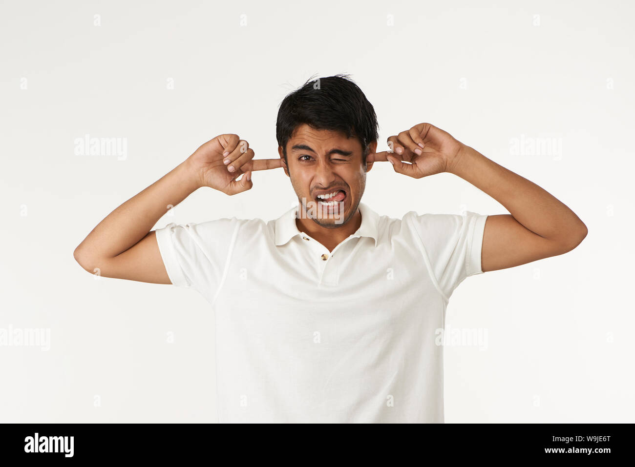 Man fingers in ears hi-res stock photography and images - Alamy