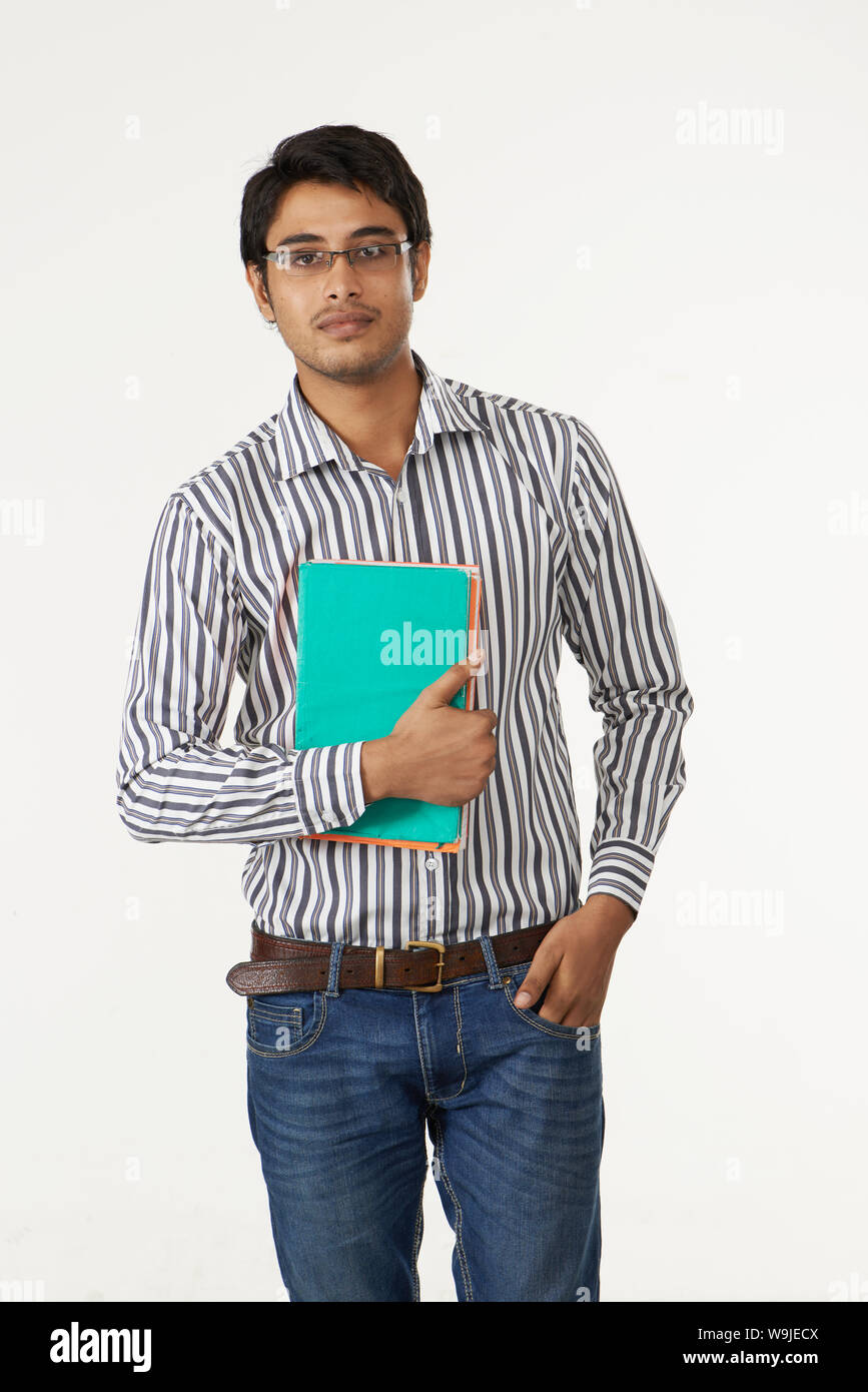College student holding books Stock Photo - Alamy