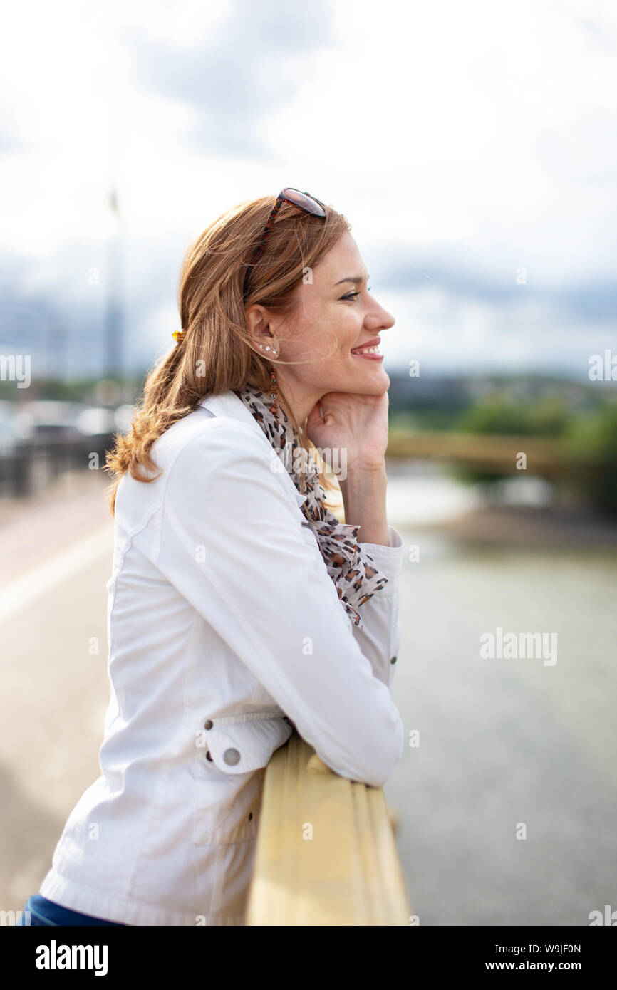 Elegant woman on bridge hi-res stock photography and images - Alamy