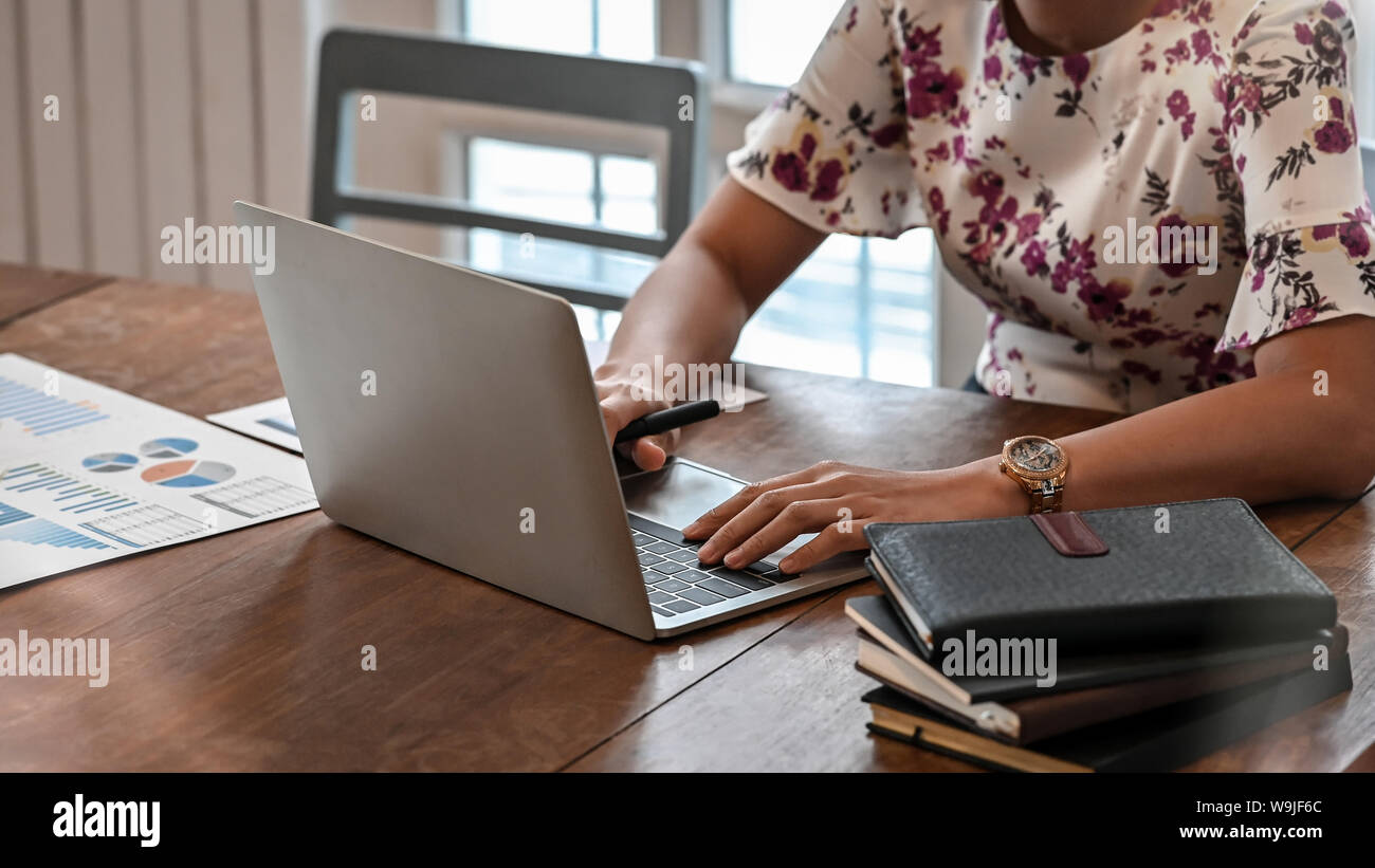 Finance people using laptop computer and businesswoman analysis ...