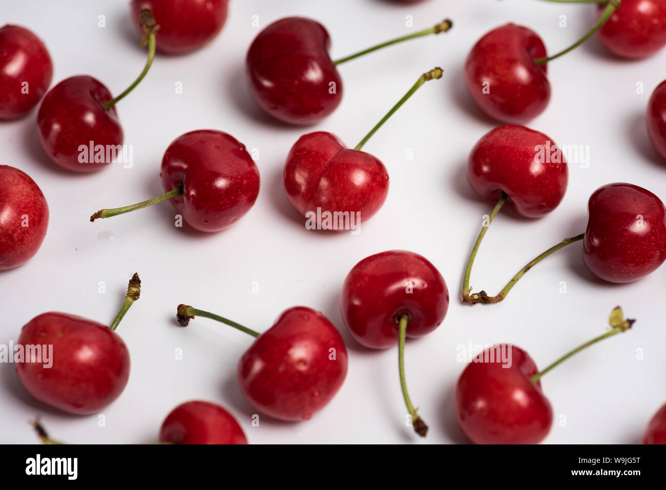 Bunch of fresh cherries on white background Stock Photo - Alamy