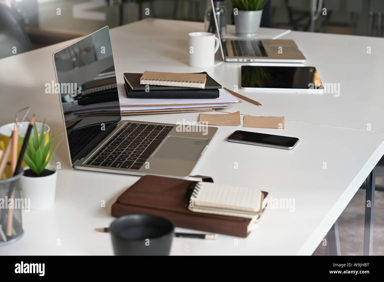 Mockup laptop computer on conference table in meeting room Stock Photo ...