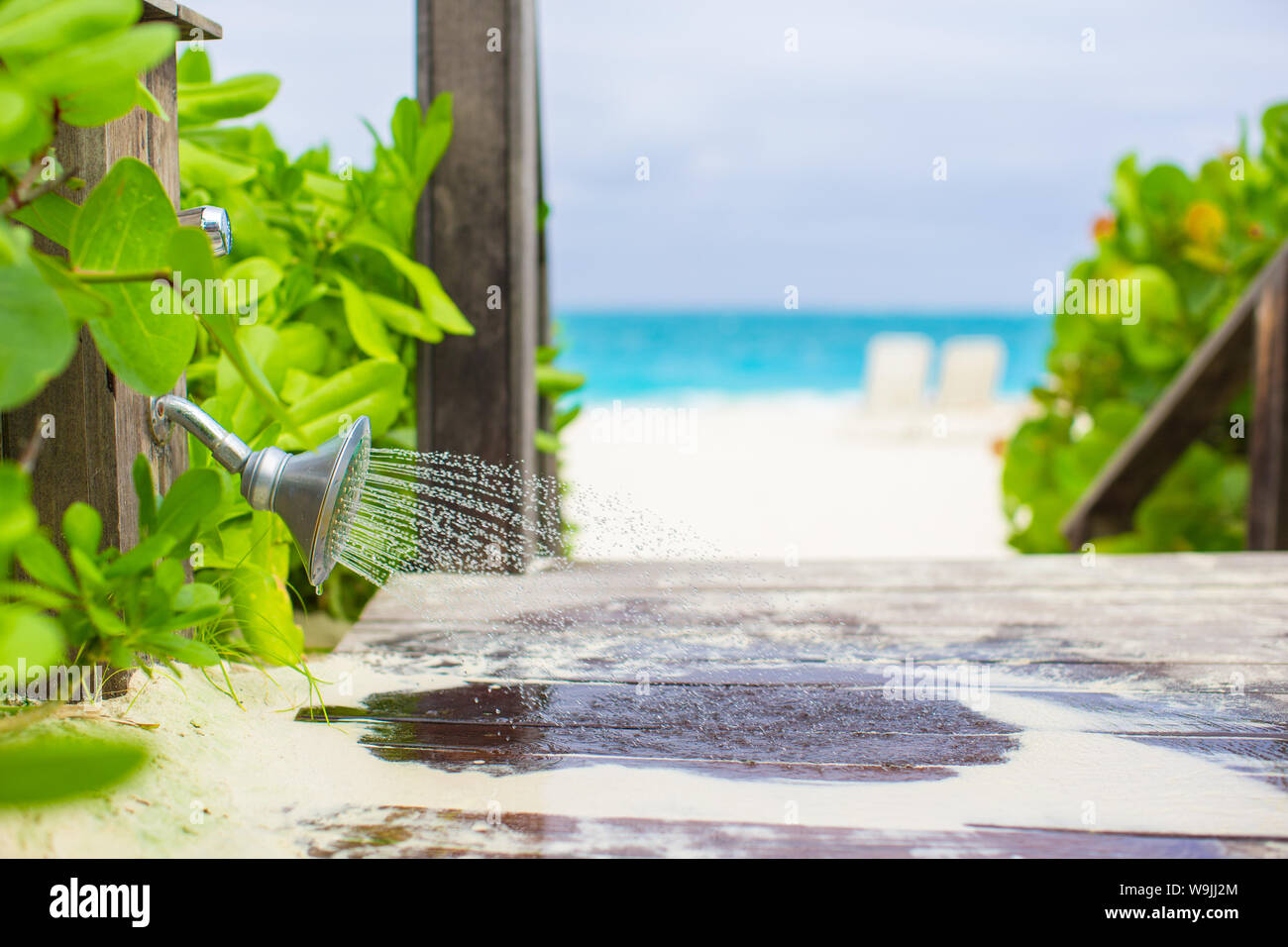 Outdoor beach resort shower with water and sea background Stock Photo ...