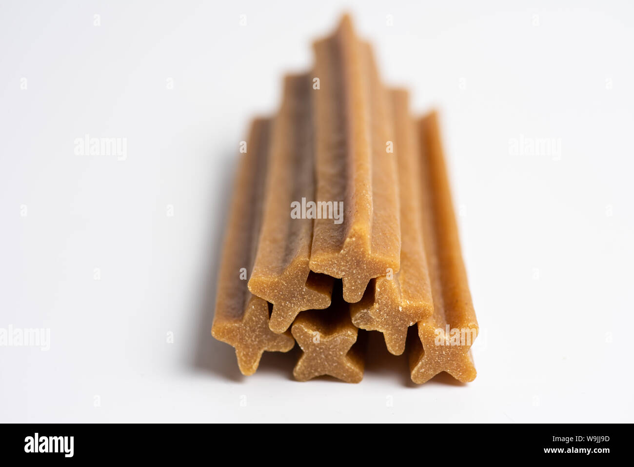 Dog food sticks on a white background Stock Photo - Alamy
