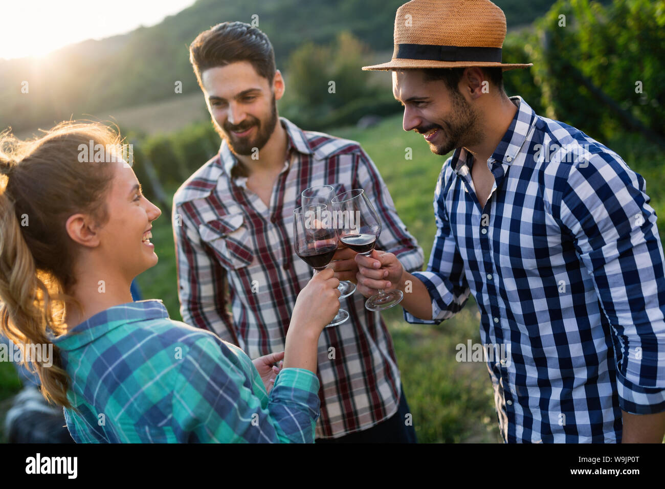 Picture of people tasting red wine in vineyard Stock Photo - Alamy