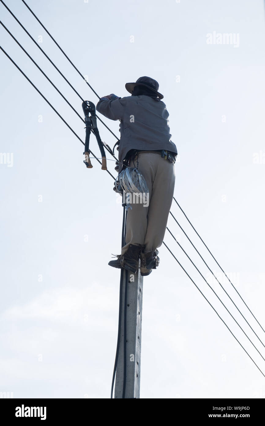 Electricty Power Lines Man Climbing. Repair Man Repair Electrical ...