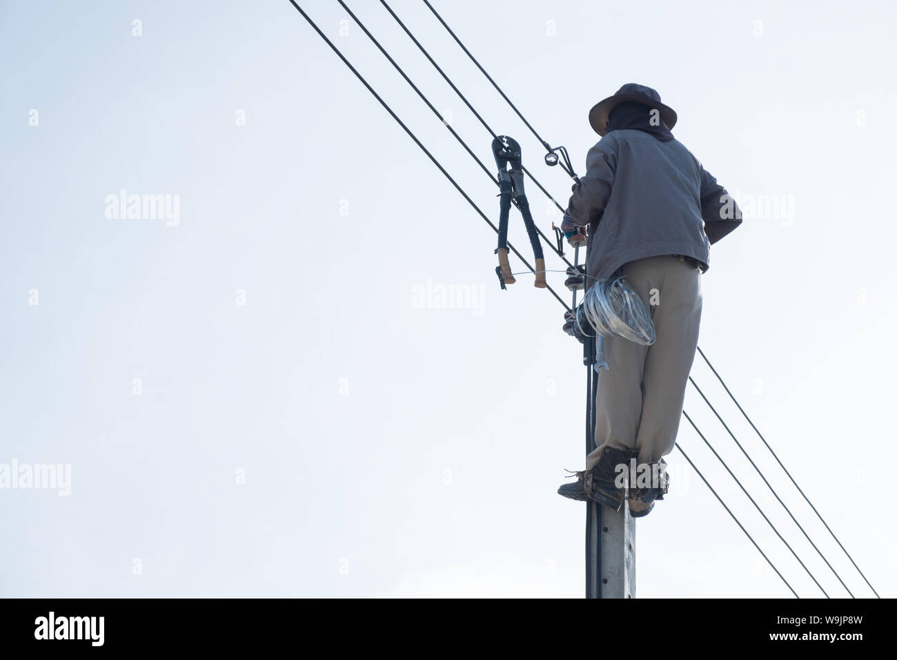 Electricty Power Lines Man Climbing. Repair Man Repair Electrical ...