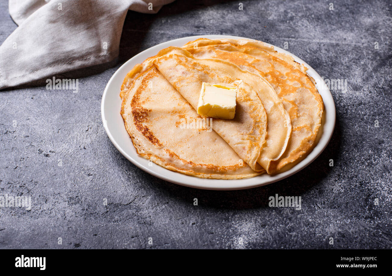 Homemade pancakes crepes on dark stone background Stock Photo - Alamy