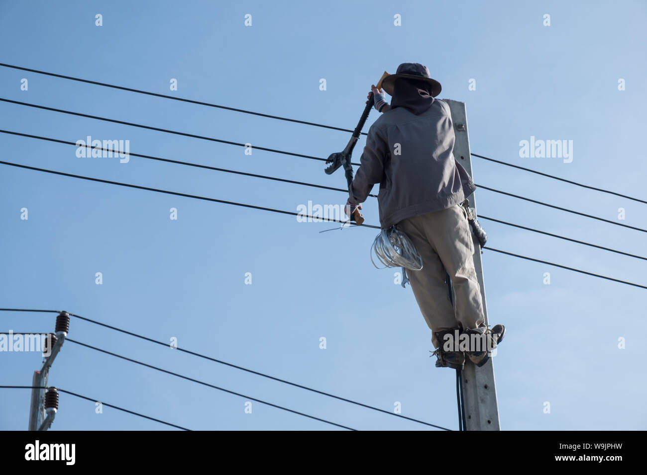Electricty Power Lines Man Climbing. Repair Man Repair Electrical ...