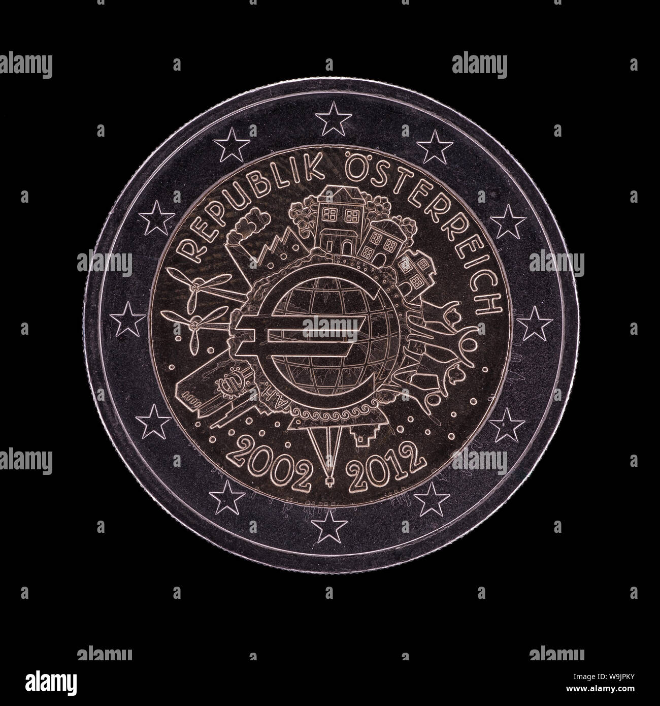 Austrian piece of a two Euro coin isolated on black background ...