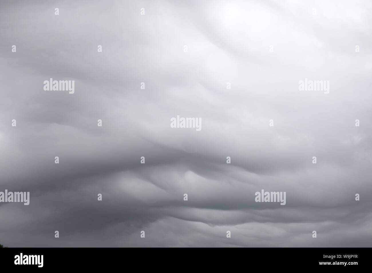 Cloudy dirk sky background texture Stock Photo - Alamy