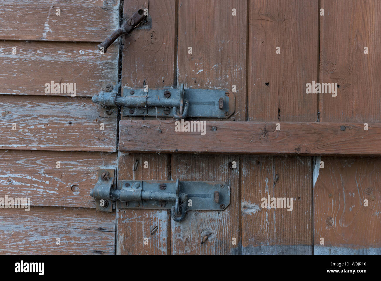 close up of locks and hinges of stables for horses in countryside Stock ...