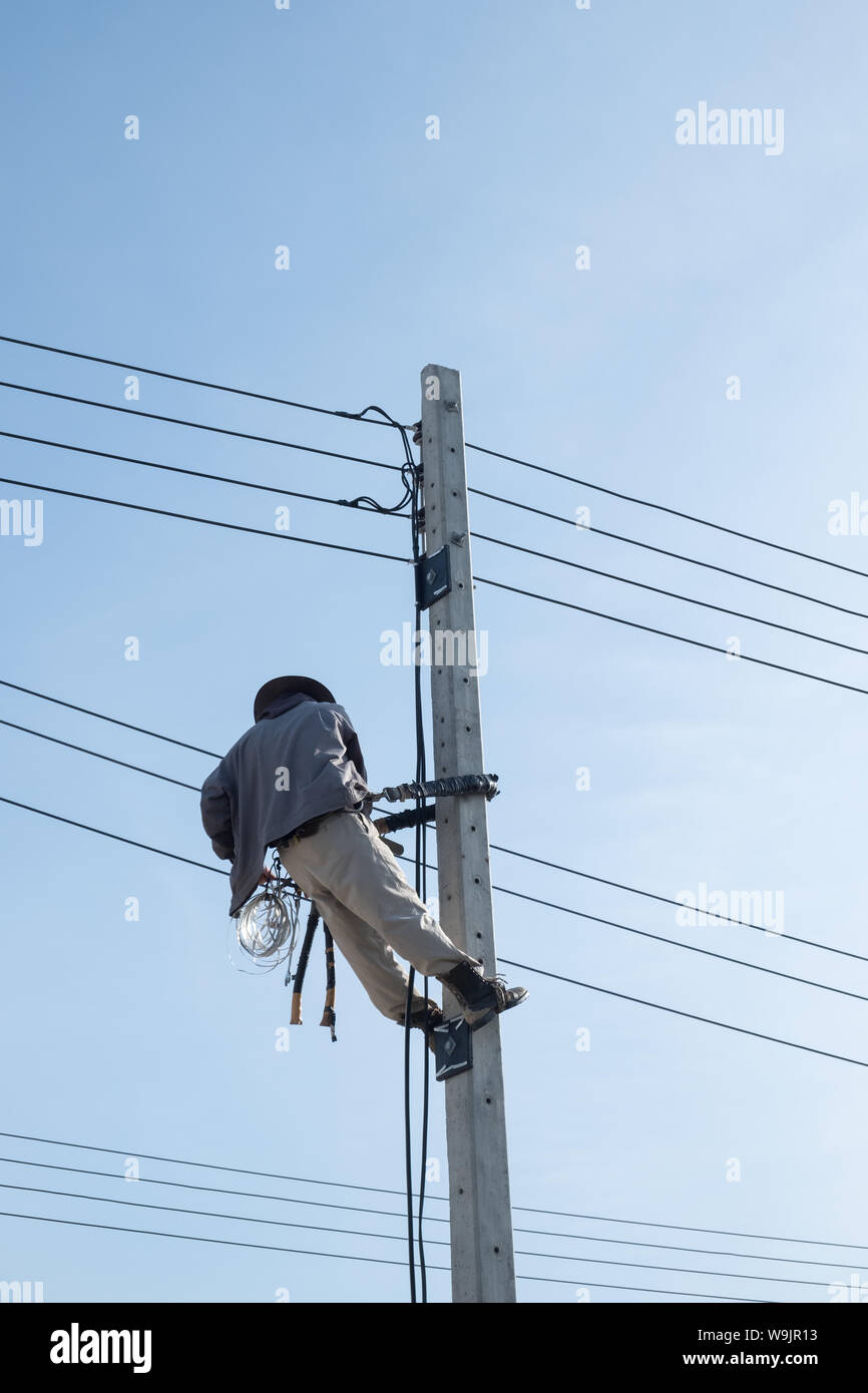 Electricty Power Lines Man Climbing. Repair Man Repair Electrical ...