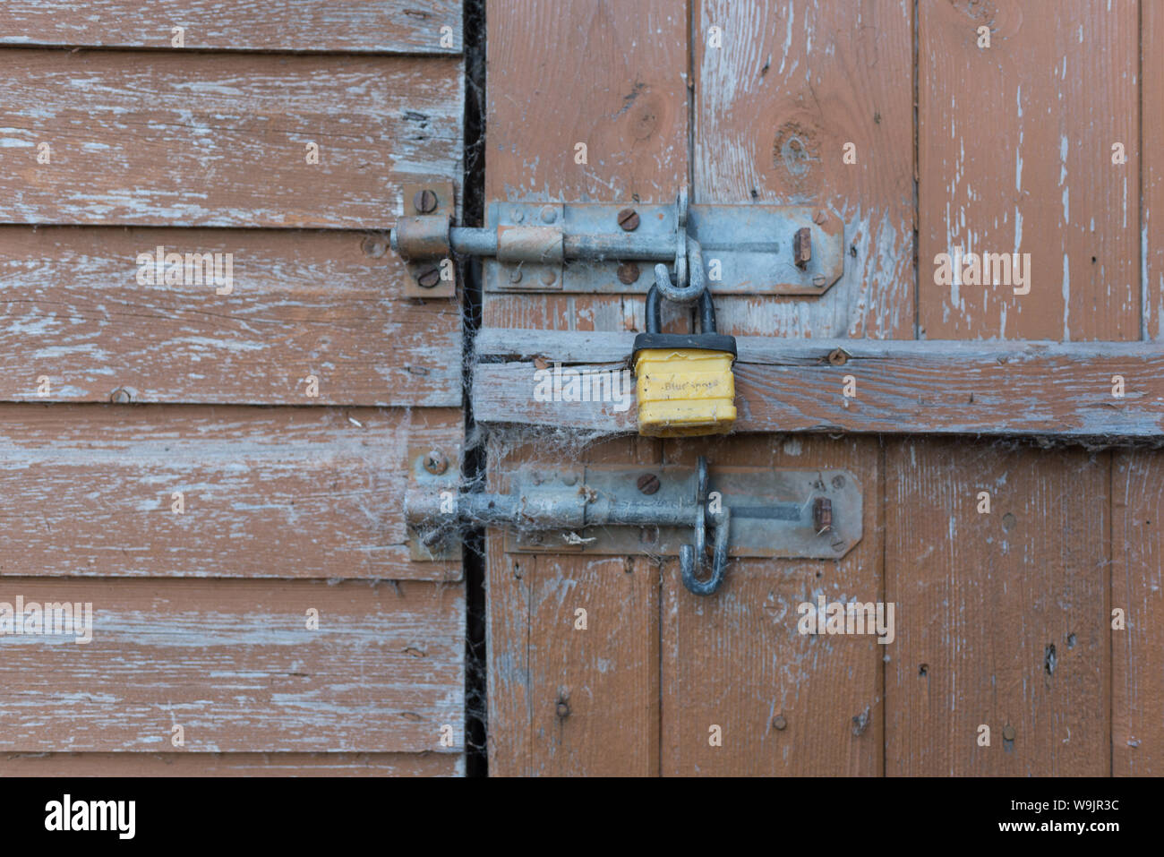 close up of locks and hinges of stables for horses in countryside Stock ...