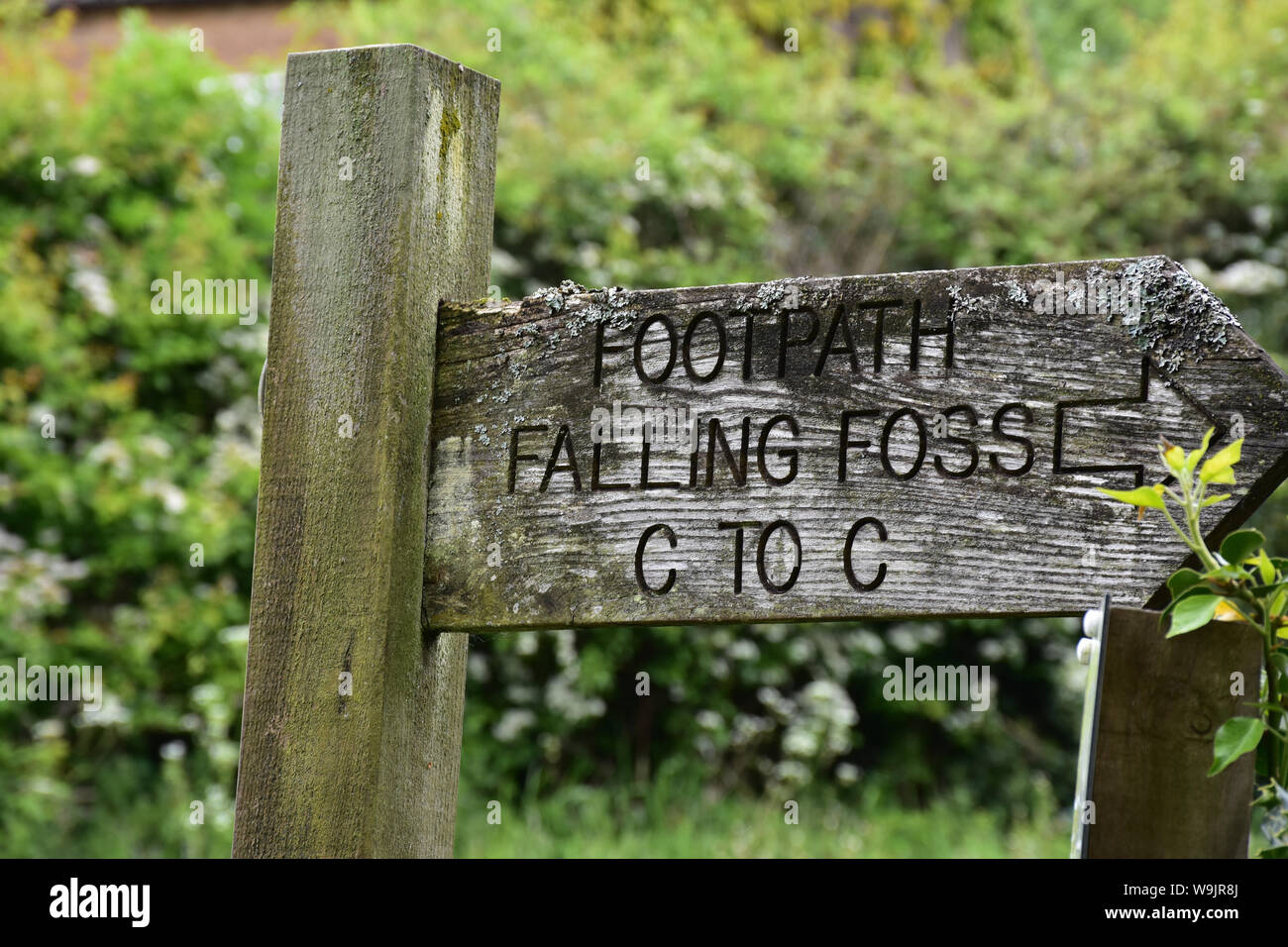 Sign marker on Coast to Coast trail indicating Falling Foss Stock Photo ...