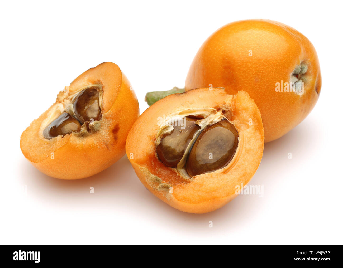 Half and whole ripe loquat fruits isolated on white background Stock ...