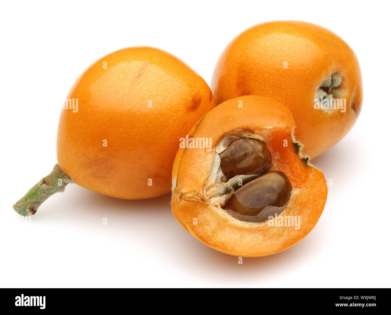 Half and whole ripe loquat fruits isolated on white background Stock ...