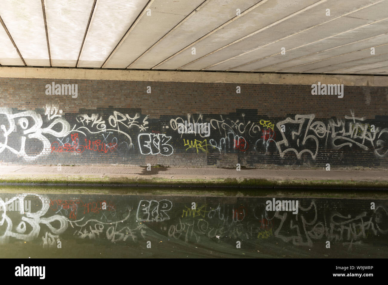 graffiti under canal tunnel Stock Photo - Alamy