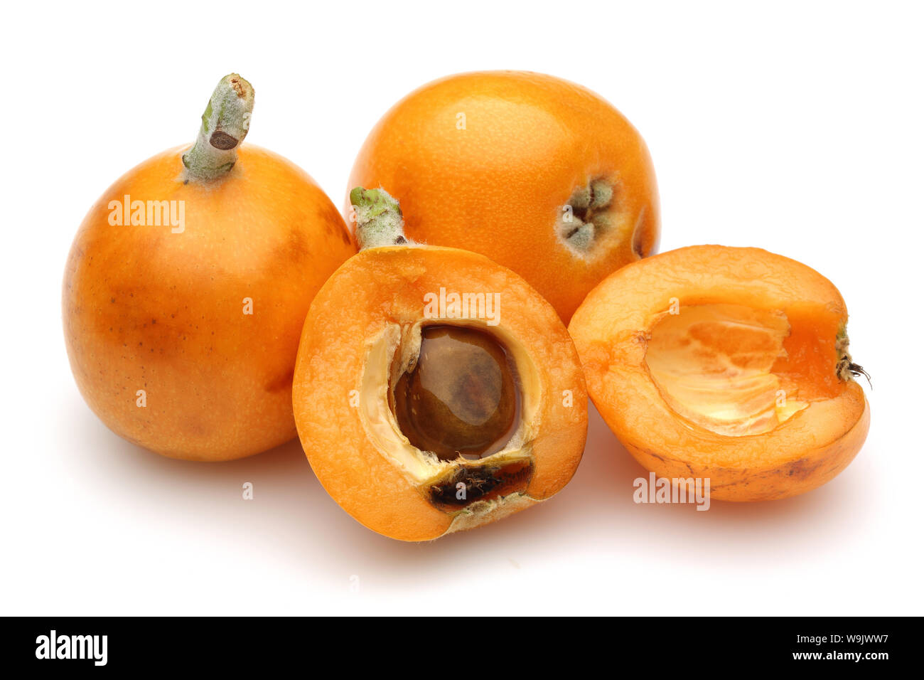 Half and whole ripe loquat fruits isolated on white background Stock ...
