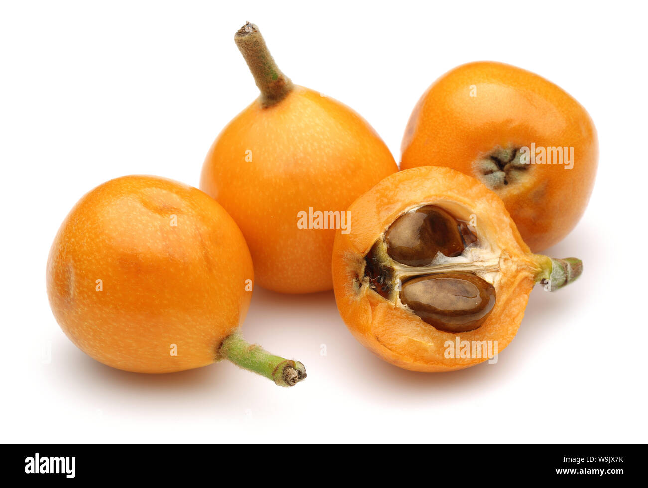 Half and whole ripe loquat fruits isolated on white background Stock ...
