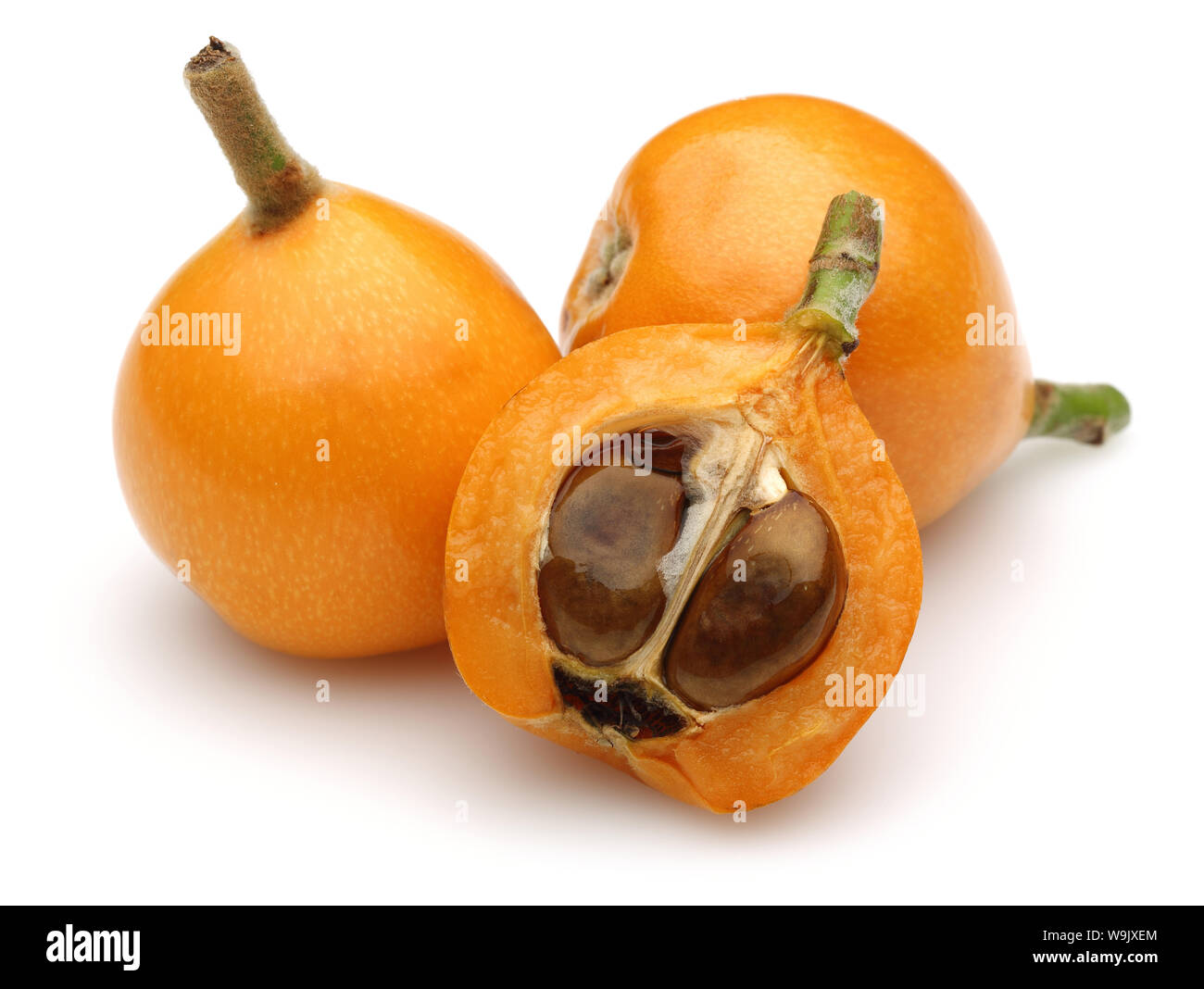 Half and whole ripe loquat fruits isolated on white background Stock ...